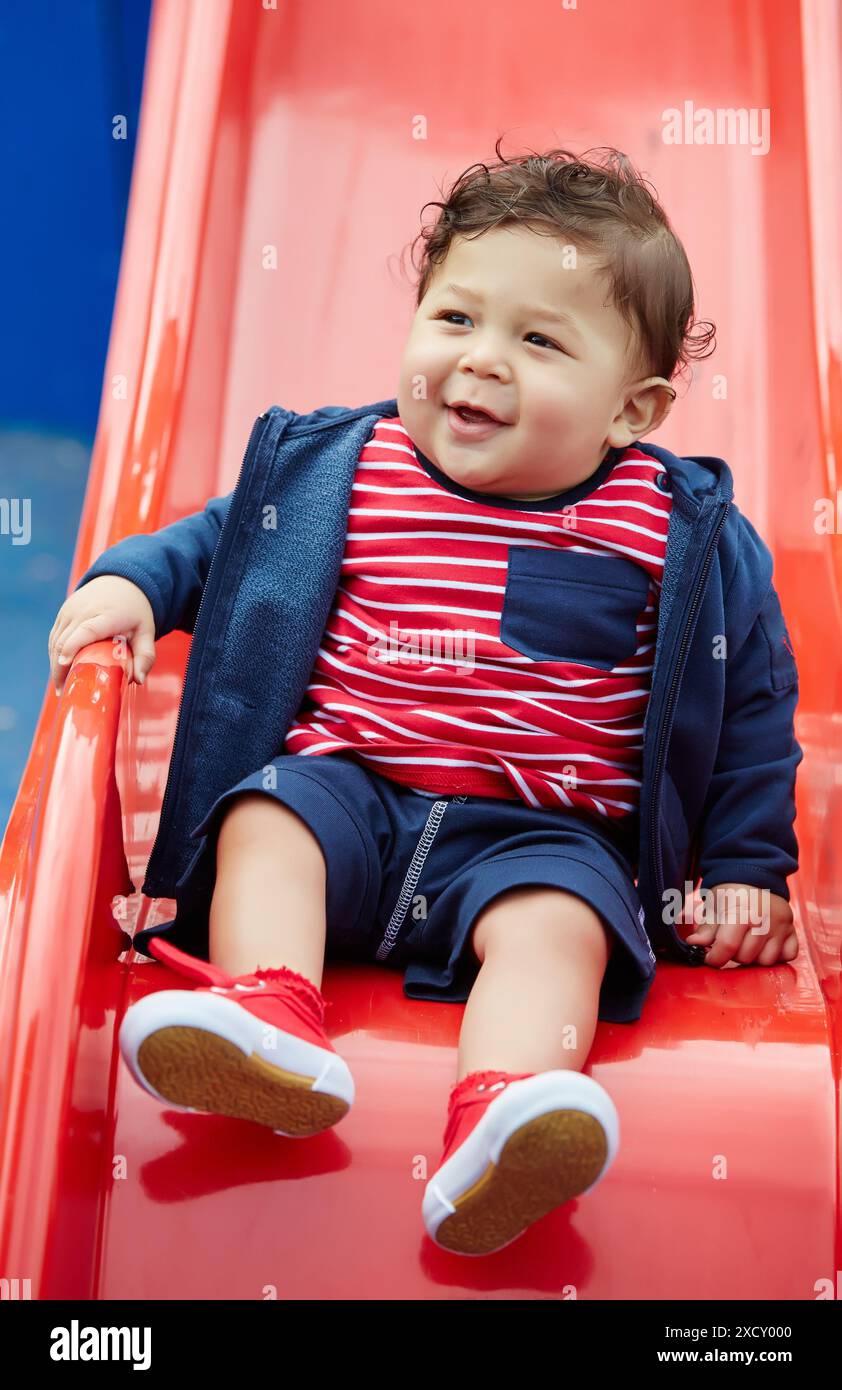 Baby playing on playground hi-res stock photography and images - Alamy