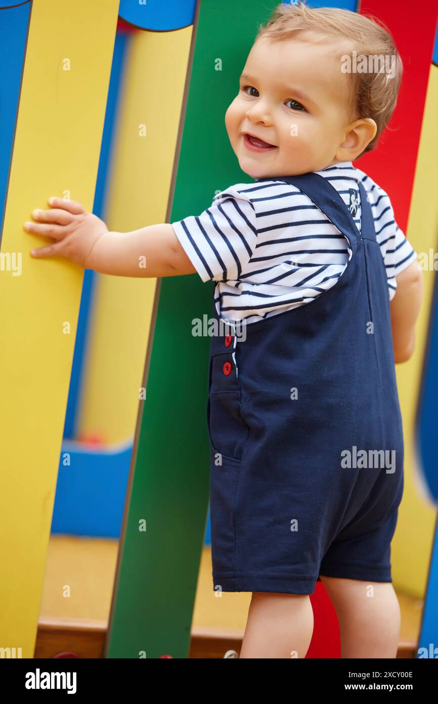 Baby on playground Stock Photo - Alamy