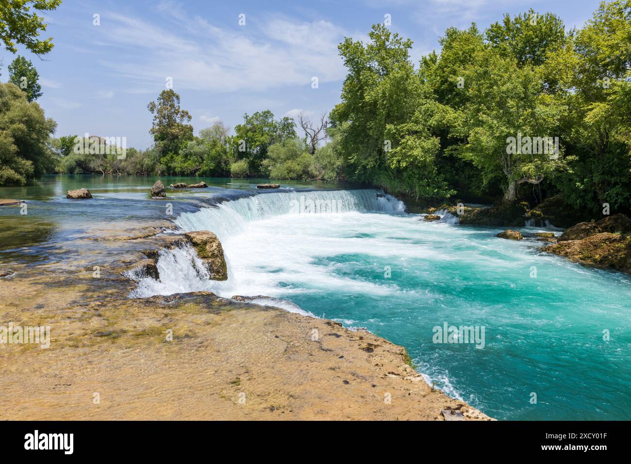 The beautiful blue waters of the Manavgat Waterfall near the Turkish ...