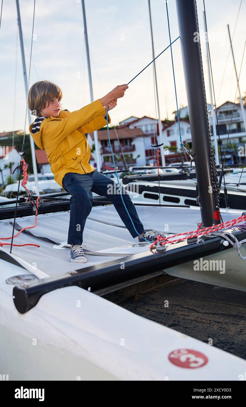 child playing with boats, Port Socoa, Ciboure, Aquitaine, Pyrenees ...