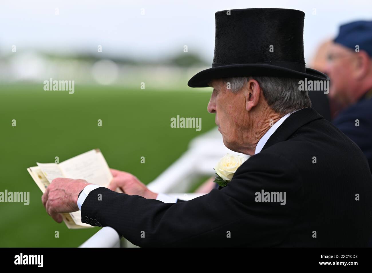 Ascot, UK. 18 June, 2024. Reviewing the Racecard during day one of ...
