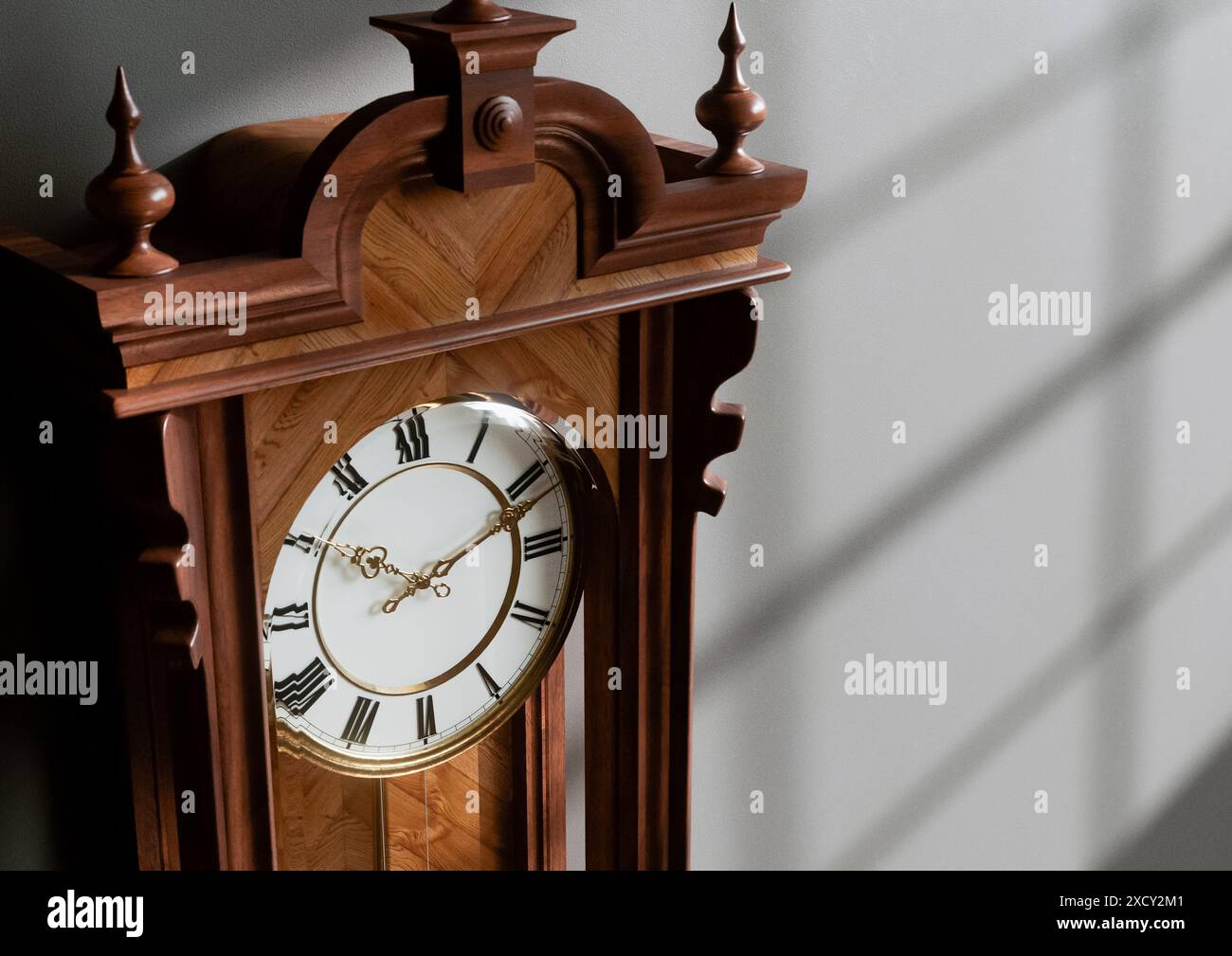 An antique wooden wall mounted grandfather clock with roman numerals ...