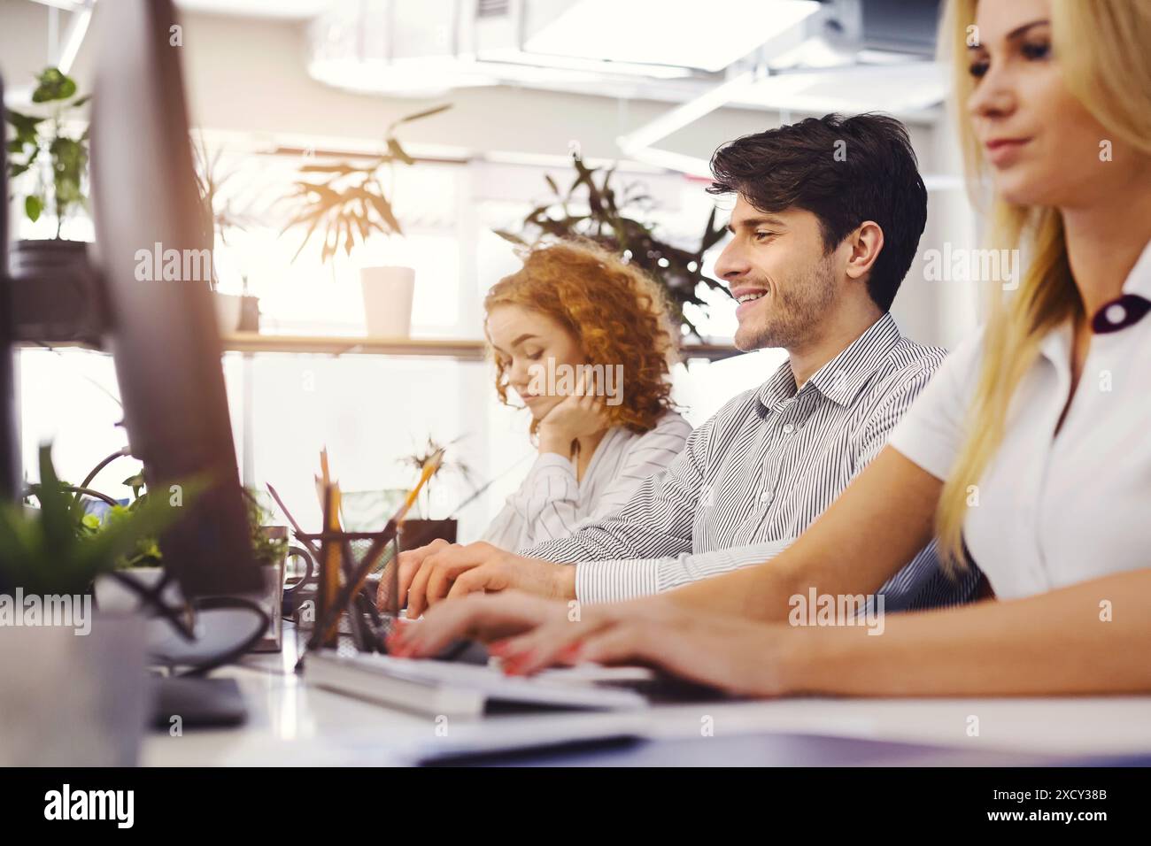 Dynamic Office with Modern Equipment and Focused Workers Stock Photo ...