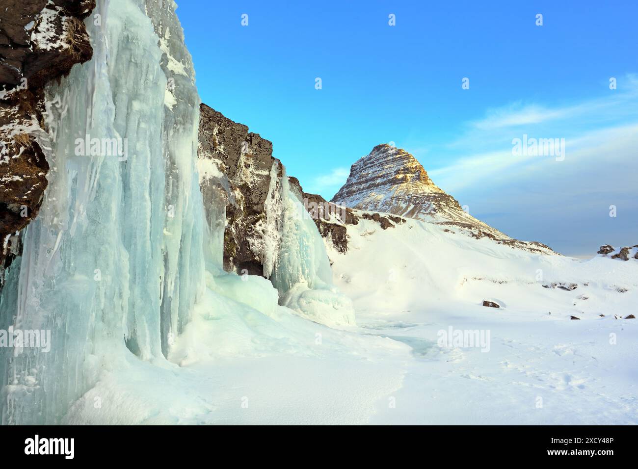 Iced kirkjufellsfoss cascade and kirkjufell mount hi-res stock ...