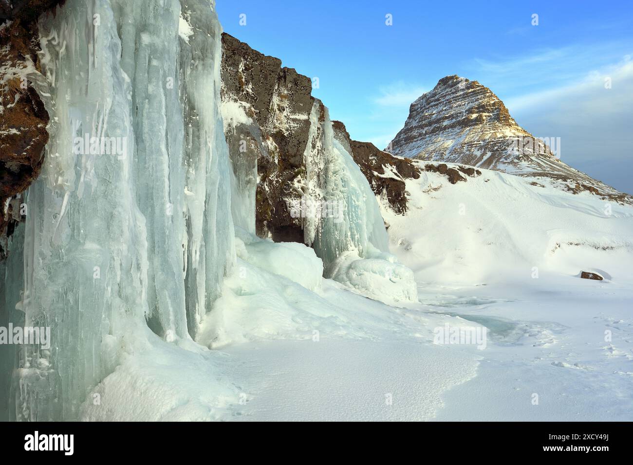 Iced kirkjufellsfoss cascade and kirkjufell mount hi-res stock ...