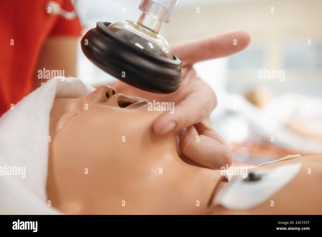 Hands of paramedic of emergency medical service during training resuscitation training on ...