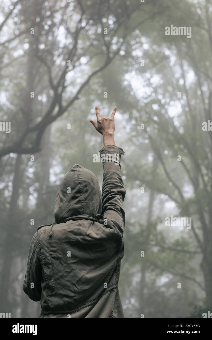 man uses sign language I love you to express his love and friendship ...
