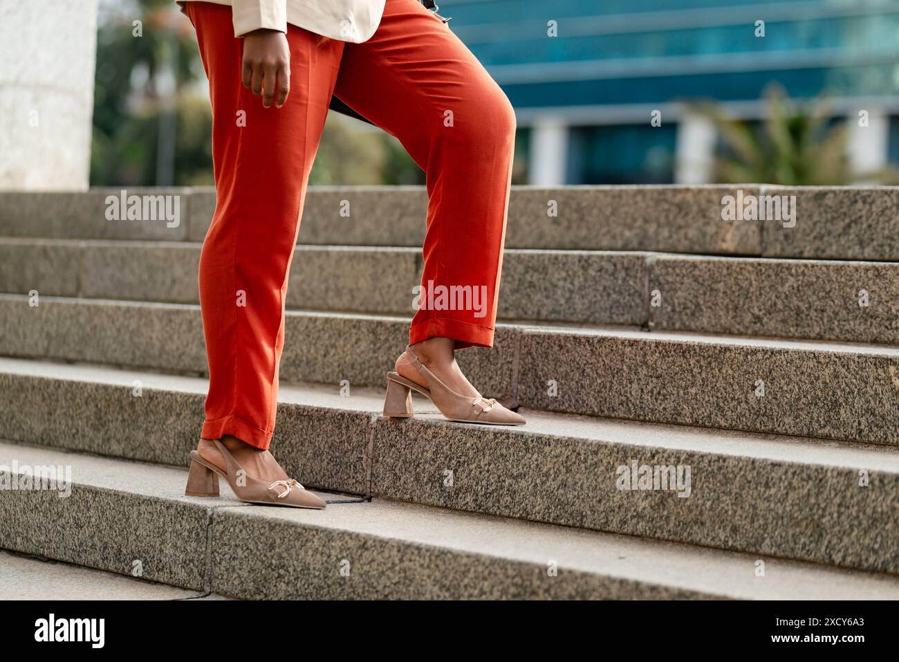 Lady climbing stairs hi-res stock photography and images - Alamy