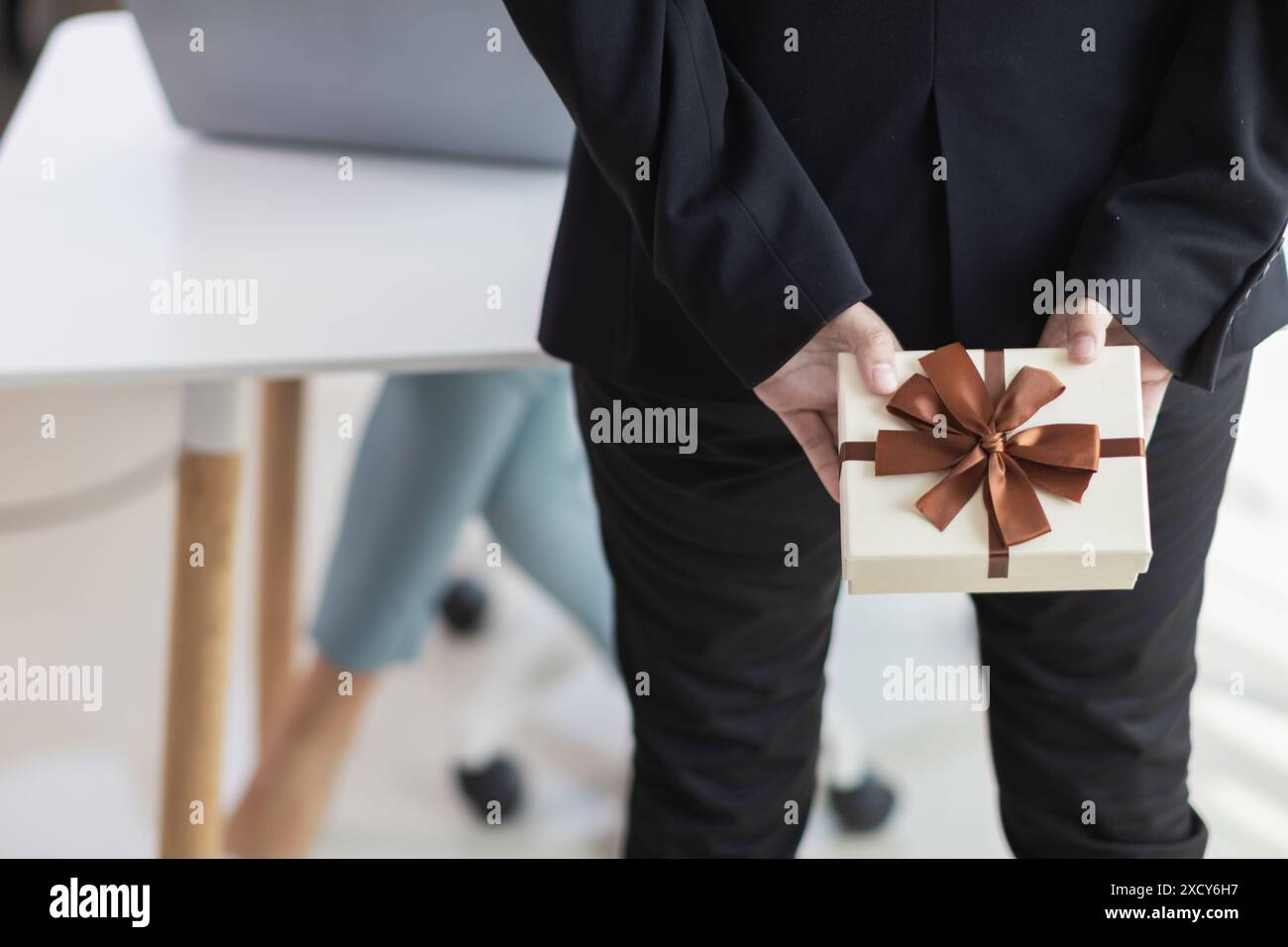 young manager prepared gift box to give to the beautiful secretary in ...