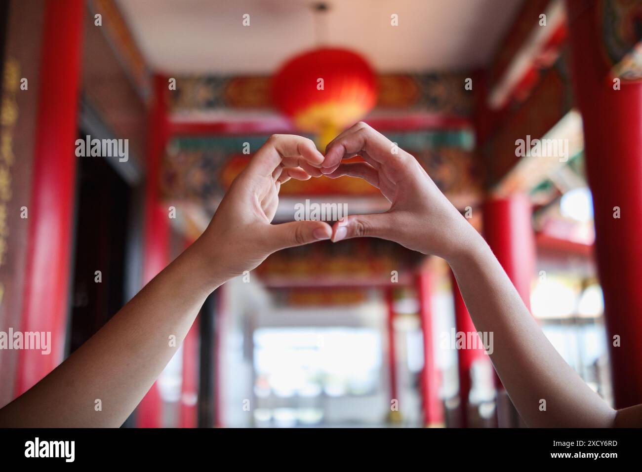 Couples display heart shaped symbols together to show their love and ...