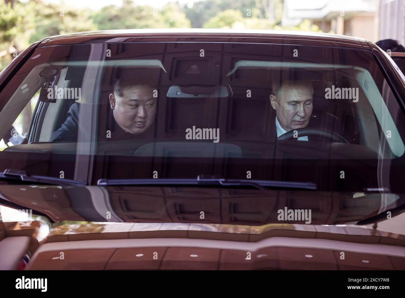 Russian President Vladimir Putin, right, and North Korea's leader Kim Jong Un drive a Russian ...
