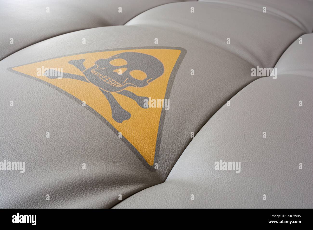 Hazard symbol on couch Stock Photo - Alamy