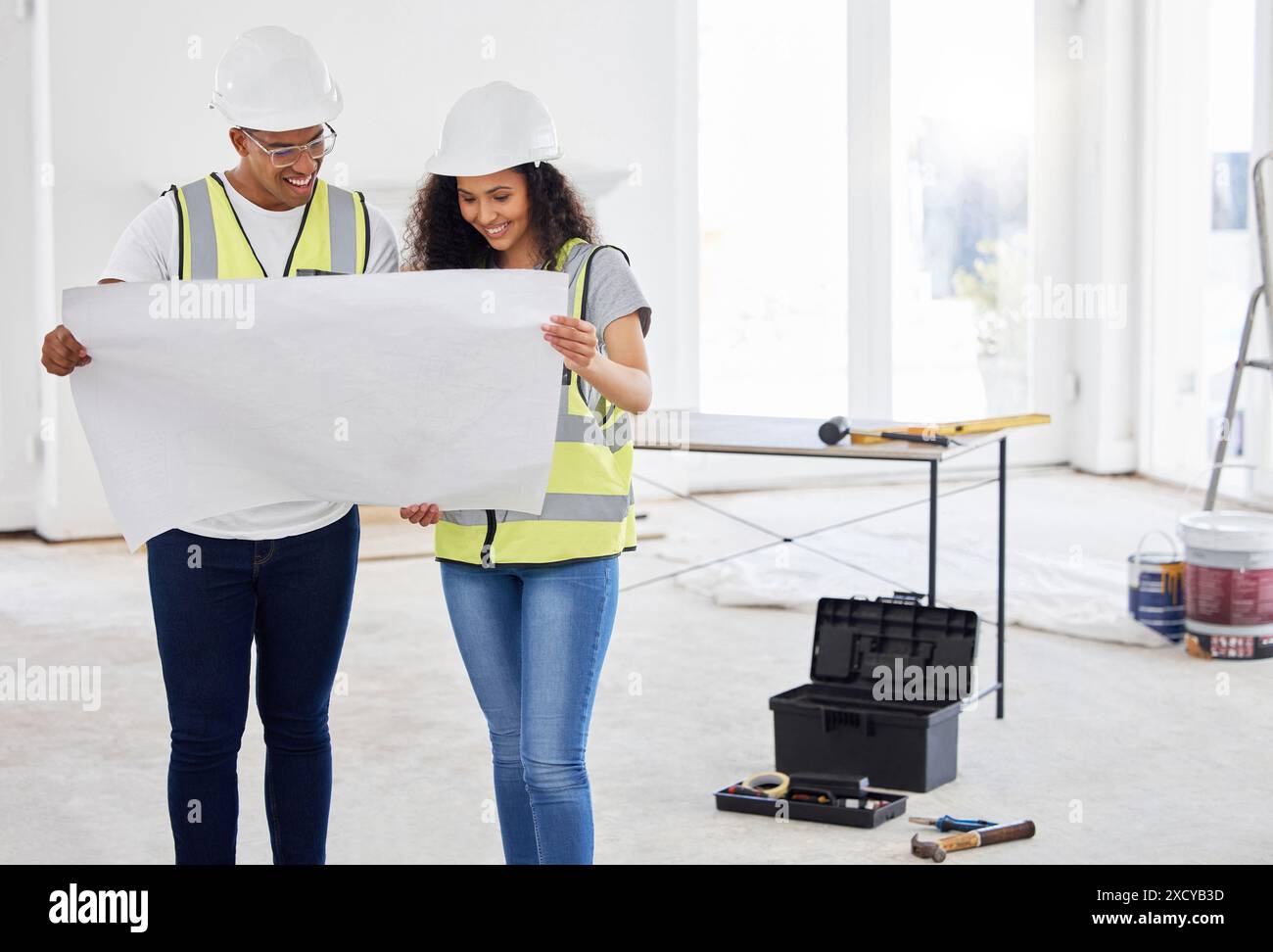 Builder, planning and blueprint of team with teamwork, engineering and ...