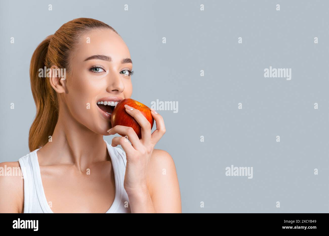 Happy healthy woman bites hi-res stock photography and images - Alamy