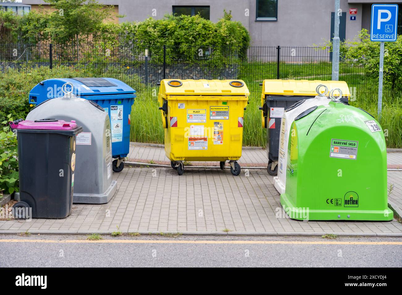 Prague, Czech Republic - June 11, 2024: Recycling bins on a city street ...