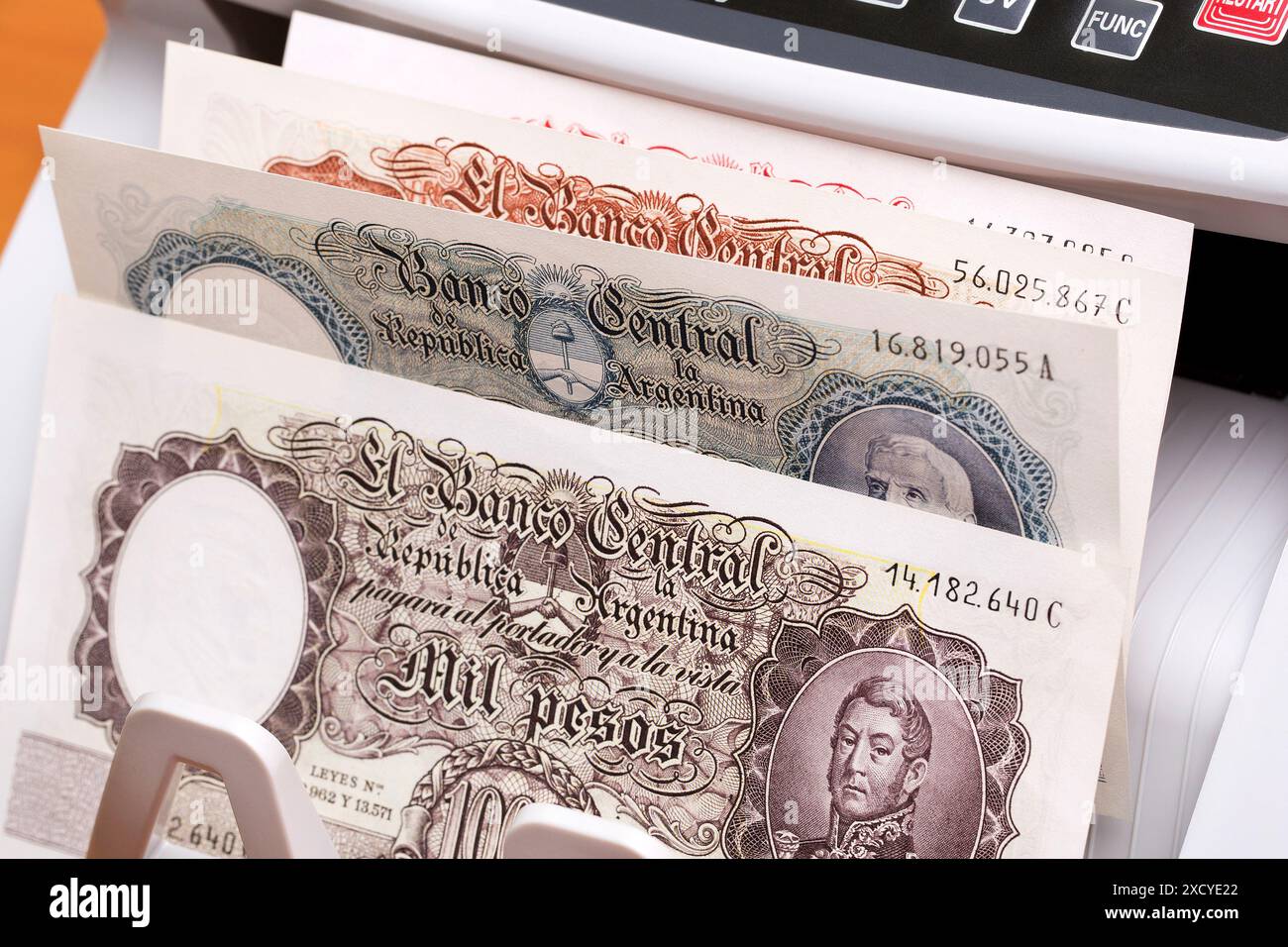 Old Argentine money - peso in the counting machine Stock Photo - Alamy