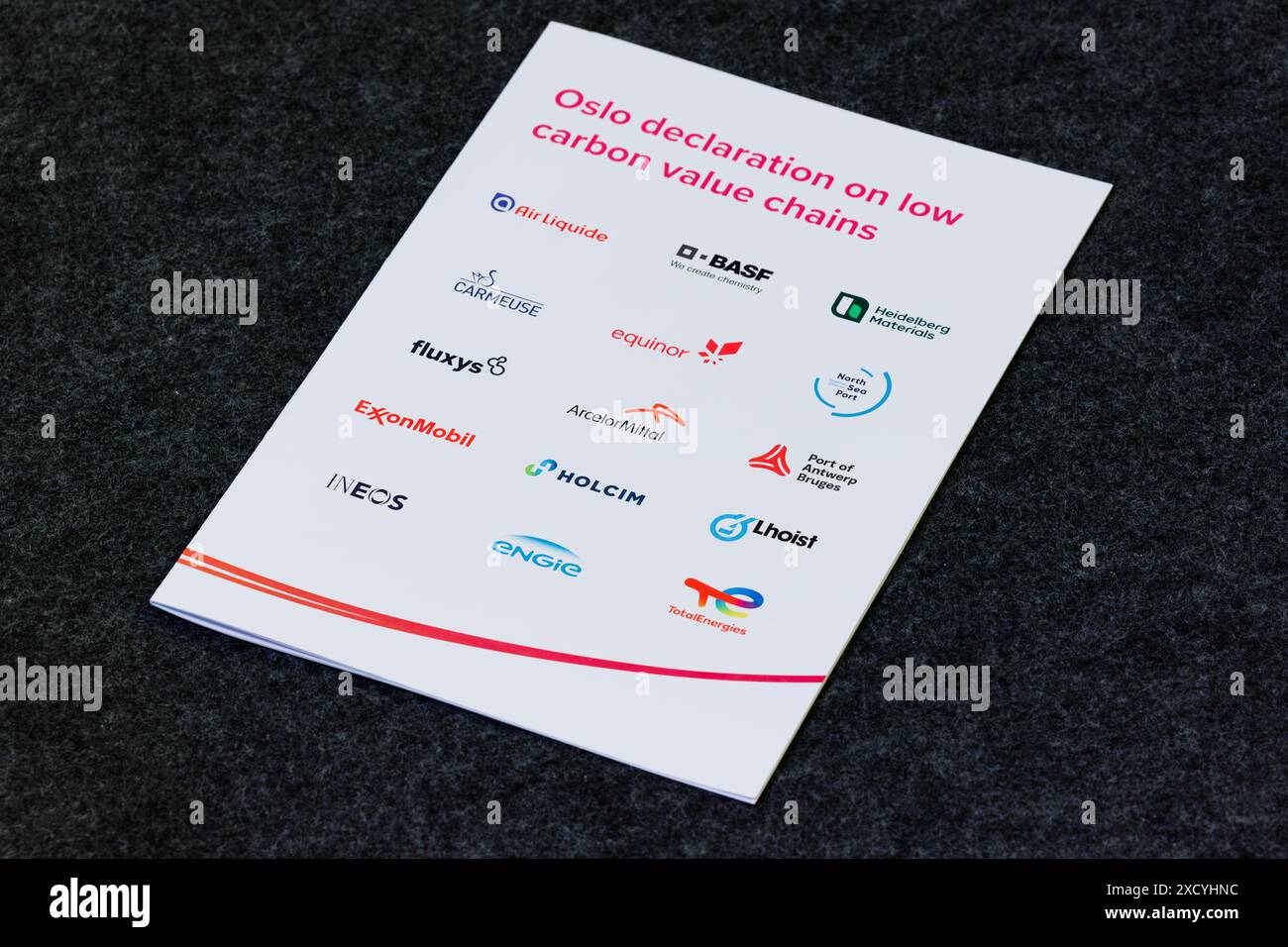 A list of participating companies pictured at a signing ceremony, the ...