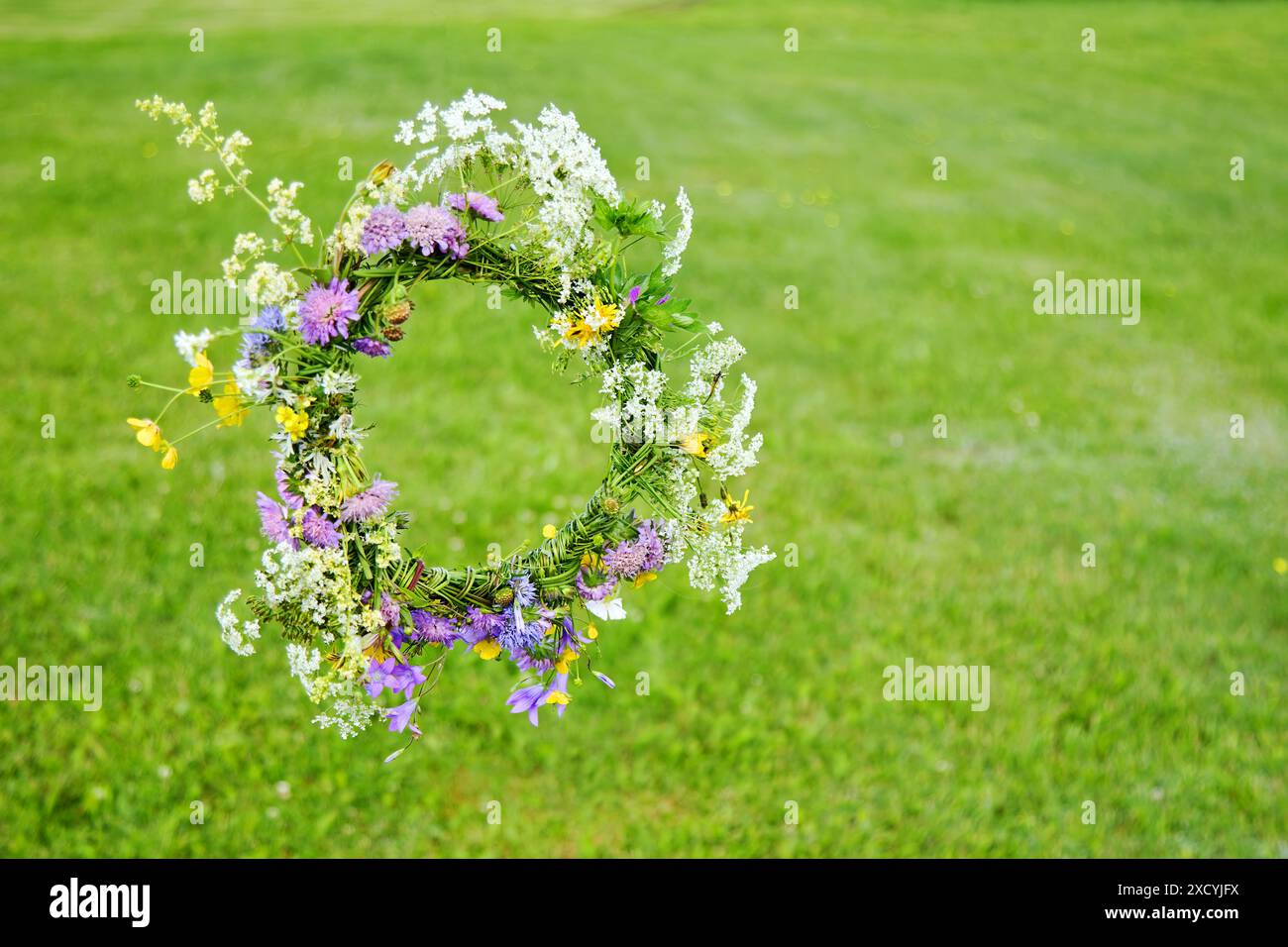 Midsummer Solstice Holiday concept. Floral Wreath on Grass Stock Photo ...