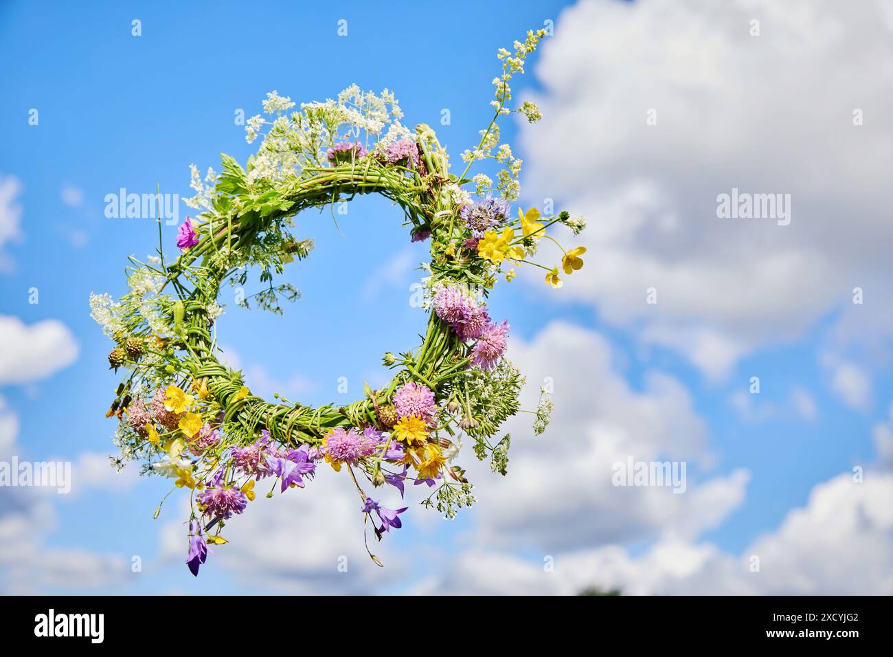 Midsummer Solstice Holiday concept. Wildflower Wreath in Nature Stock ...