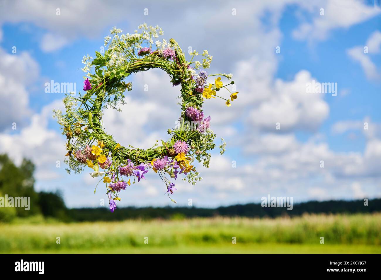 Midsummer Solstice Holiday concept. Wildflower Wreath in Nature Stock ...