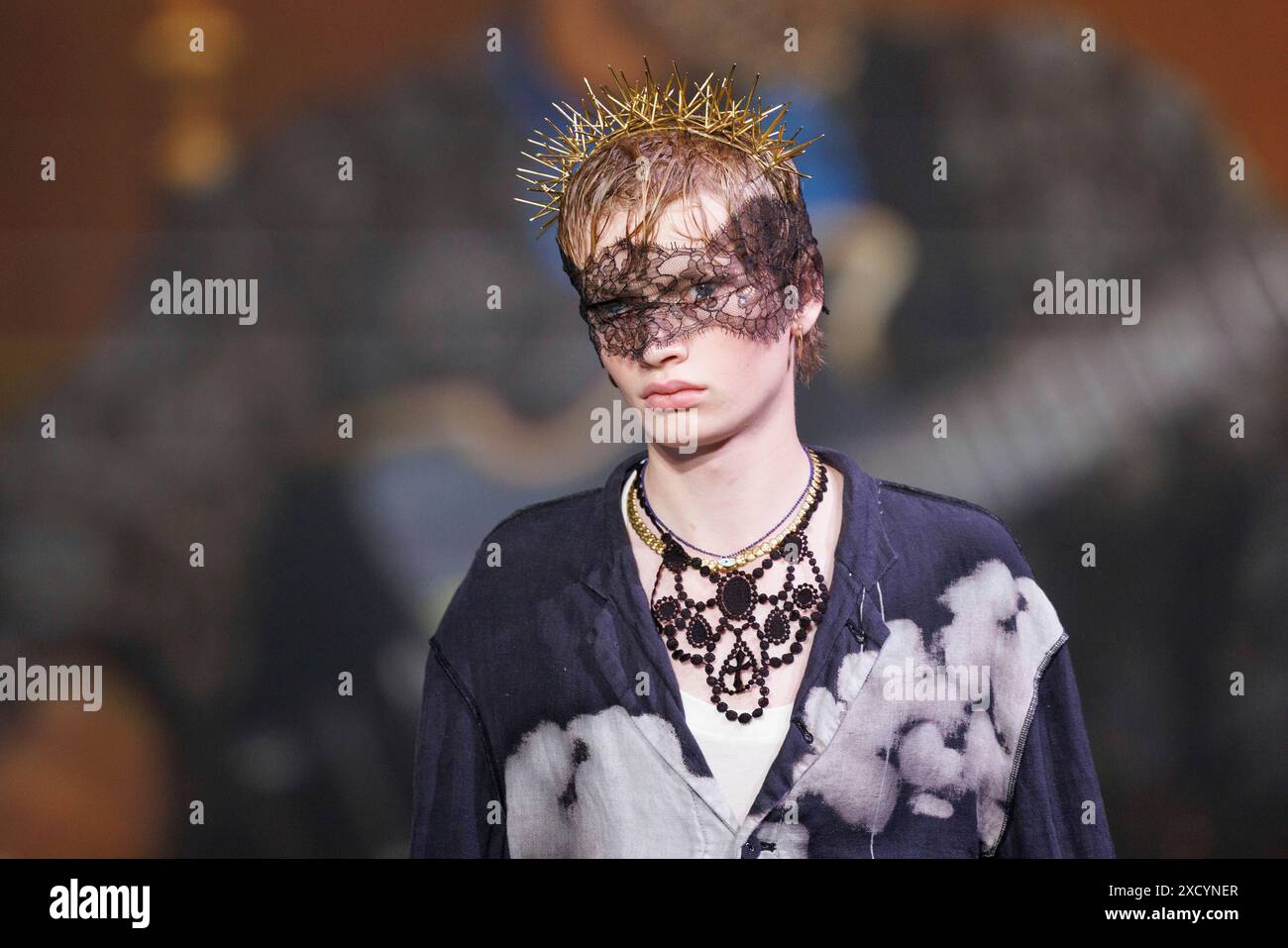 A model wears a creation for the Undercover Spring Summer 2025 ...