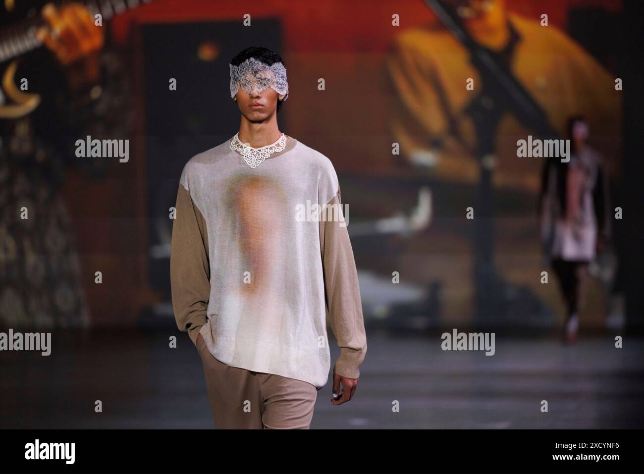 A model wears a creation for the Undercover Spring Summer 2025 ...