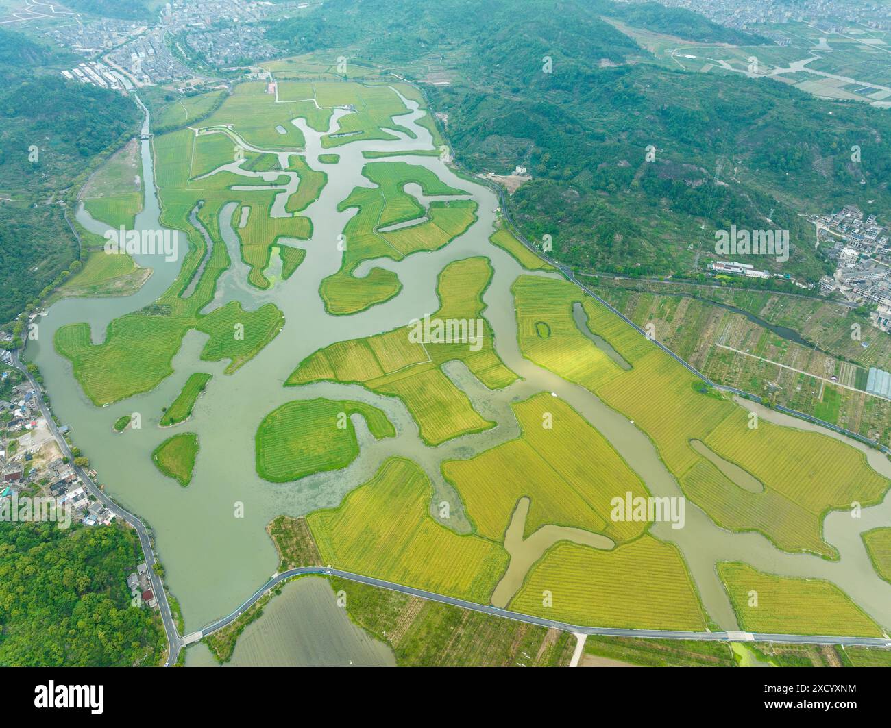 TAIZHOU, CHINA - MAY 3, 2024 - The Taojiang River divides the fields ...