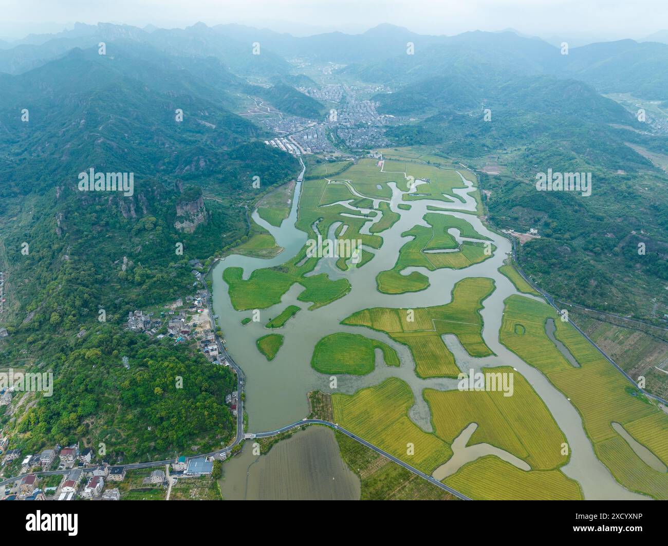 TAIZHOU, CHINA - MAY 3, 2024 - The Taojiang River divides the fields ...