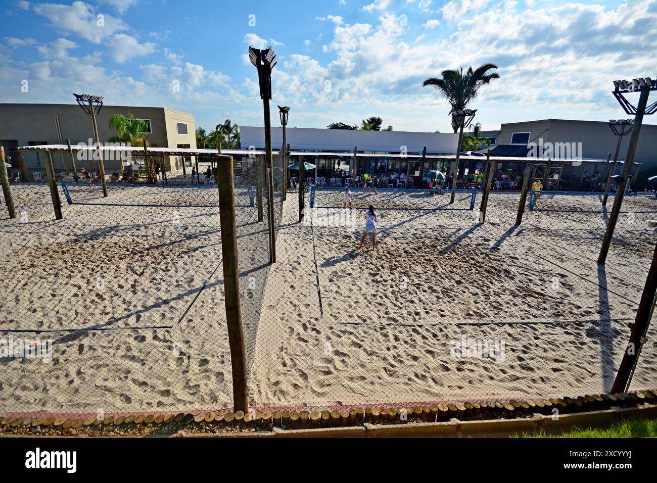 Athletes playing in beach tennis competition Stock Photo - Alamy