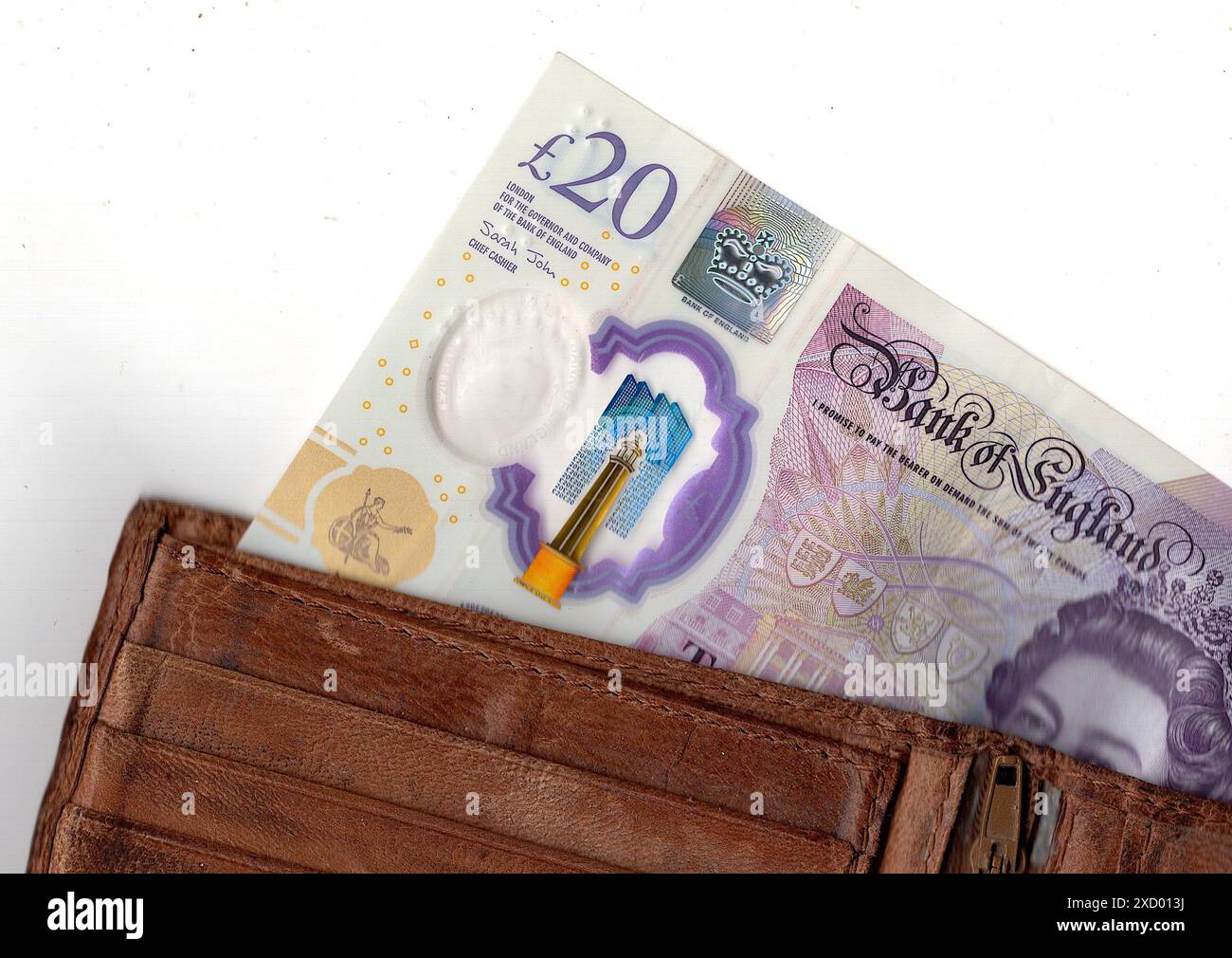 A leather wallet and modern polymer twenty pound banknote from the ...