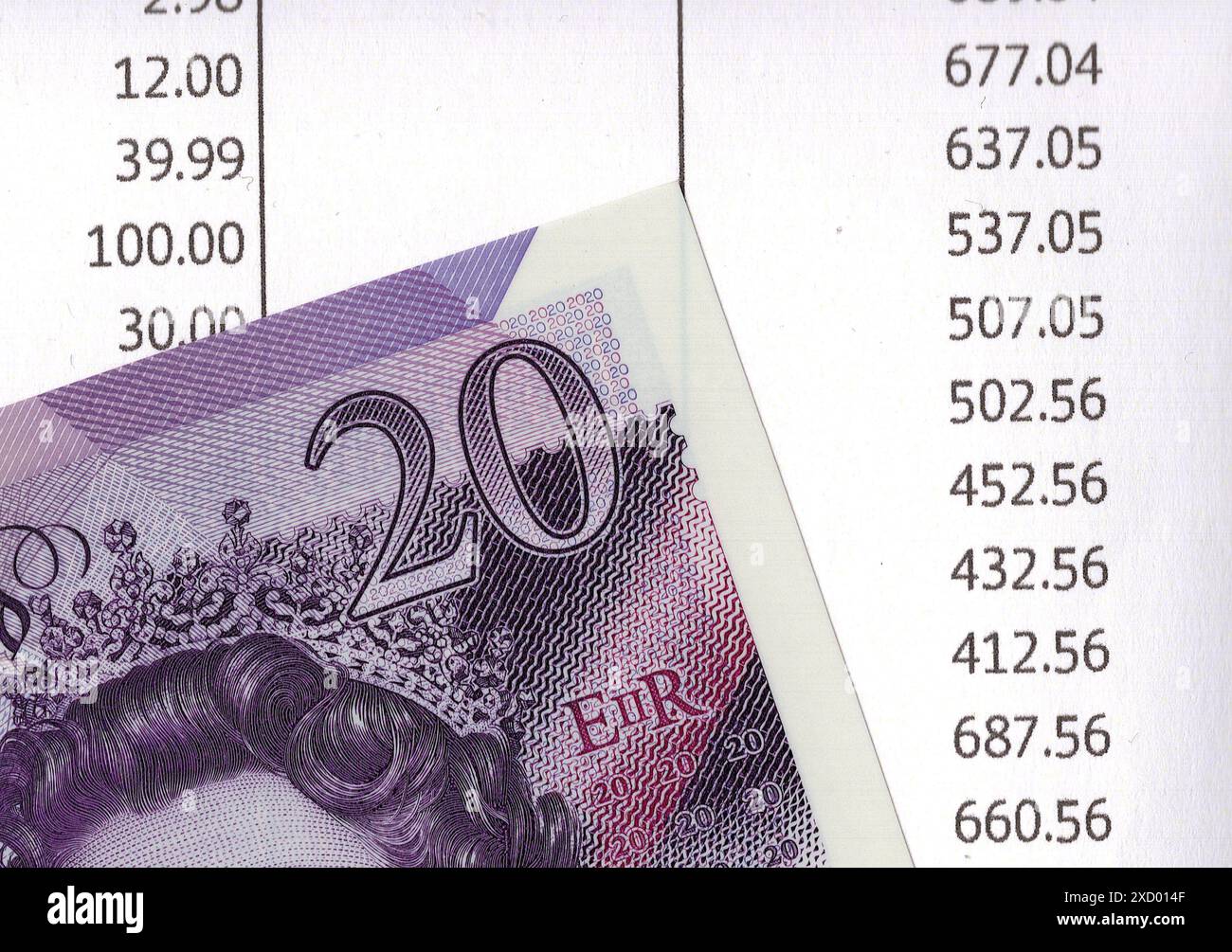 A bank statement and a modern polymer banknote from the United Kingdom ...
