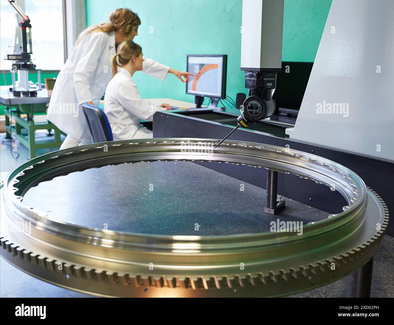 Technicians inspecting aircraft component. Measurement of a piece in ...