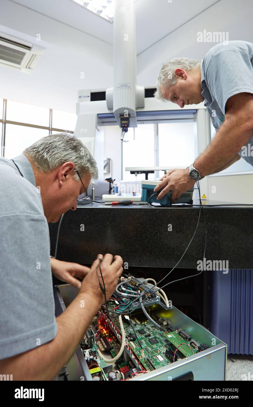 The SAT team calibrating three-dimensional machine. Calibration of CMM ...