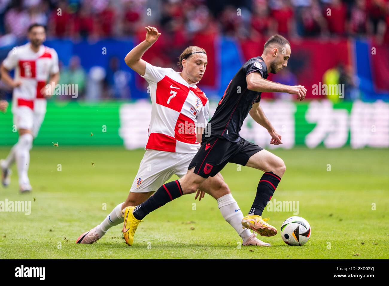 Hamburg, Germany. 19th, June 2024. Mario Mitaj (3) of Albania and Lovro ...
