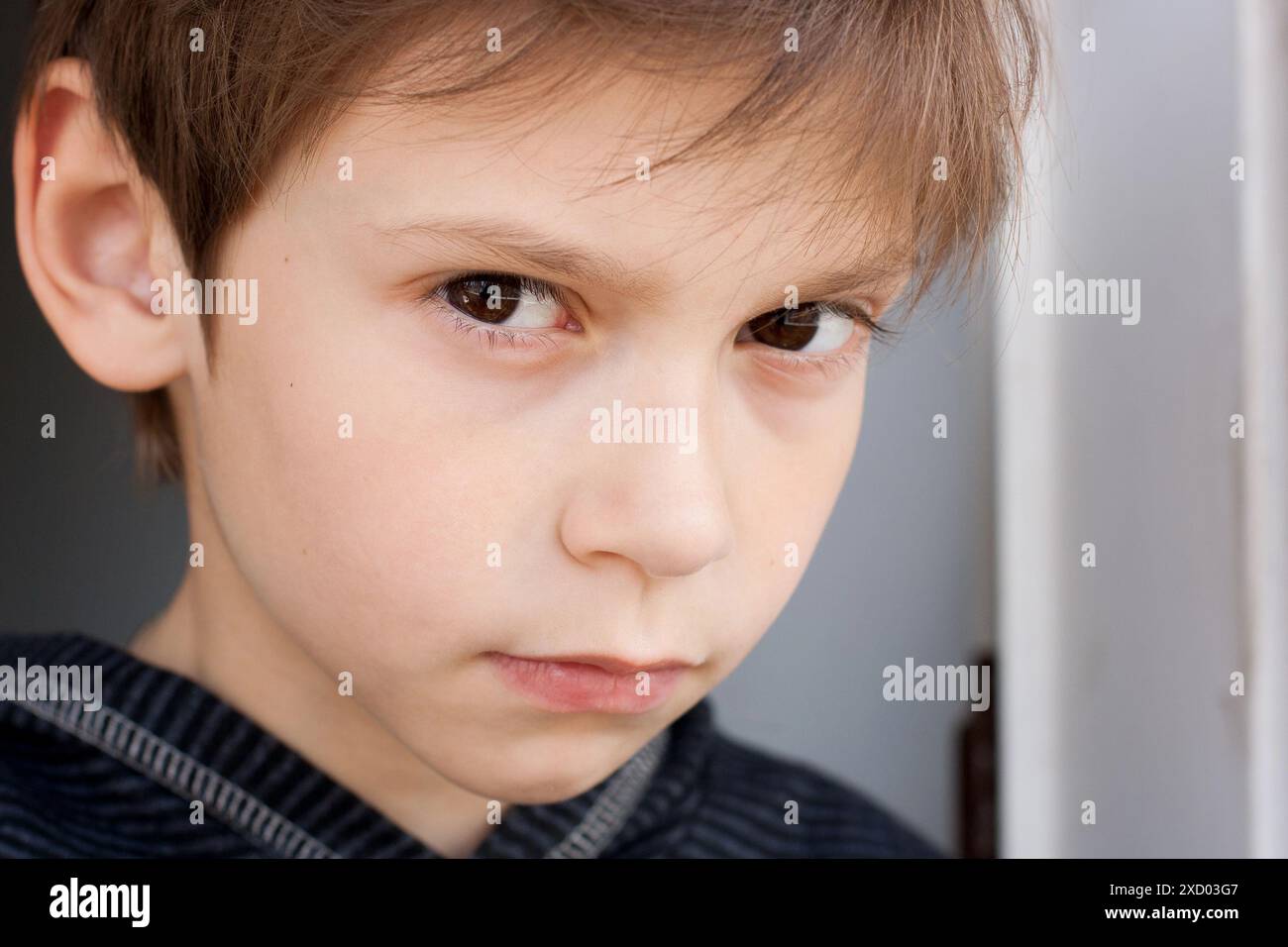 portrait of a serious upset little boy Stock Photo - Alamy