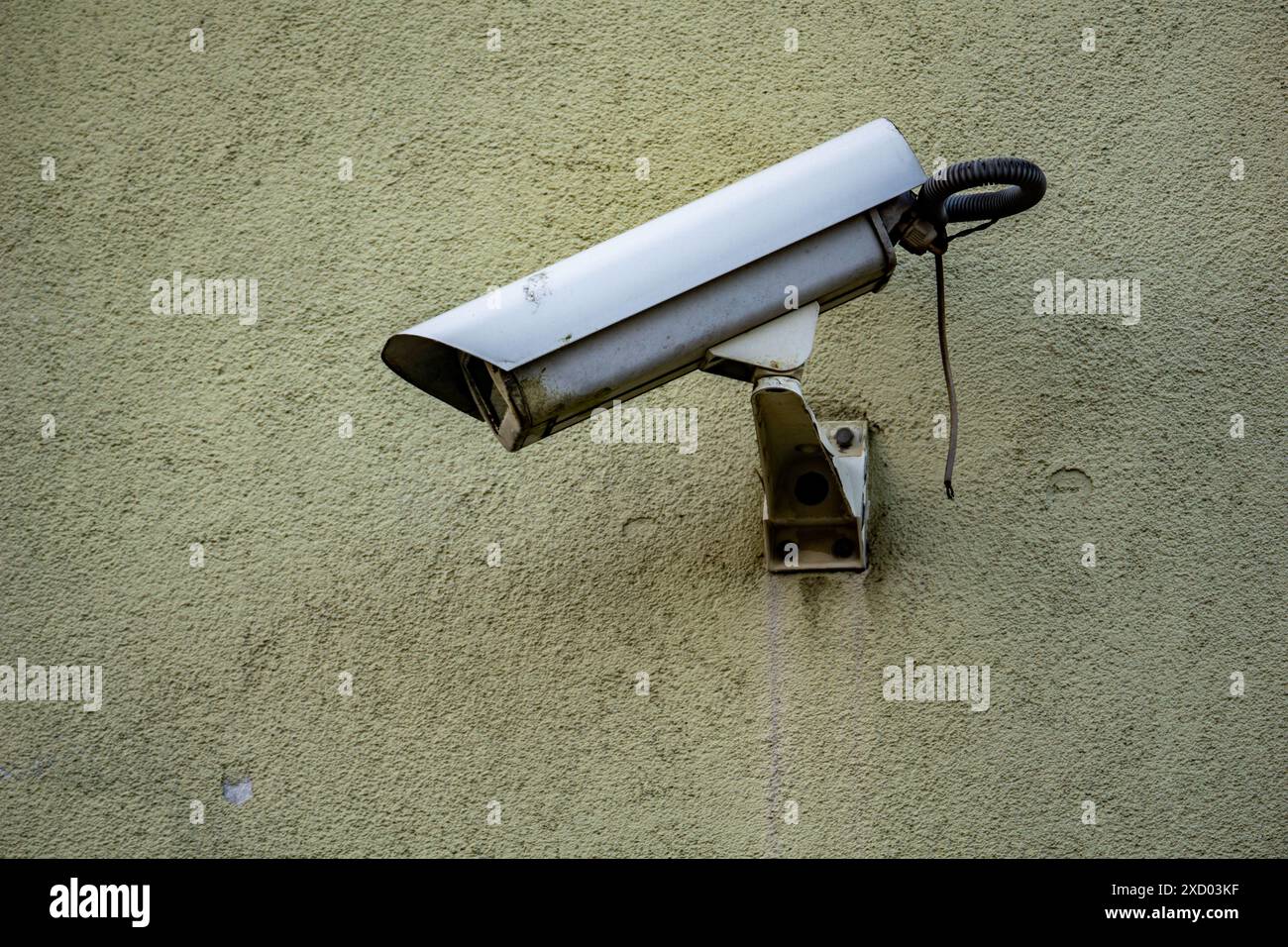 Security Camera Mounted on a Green Wall monitoring state surveillance ...