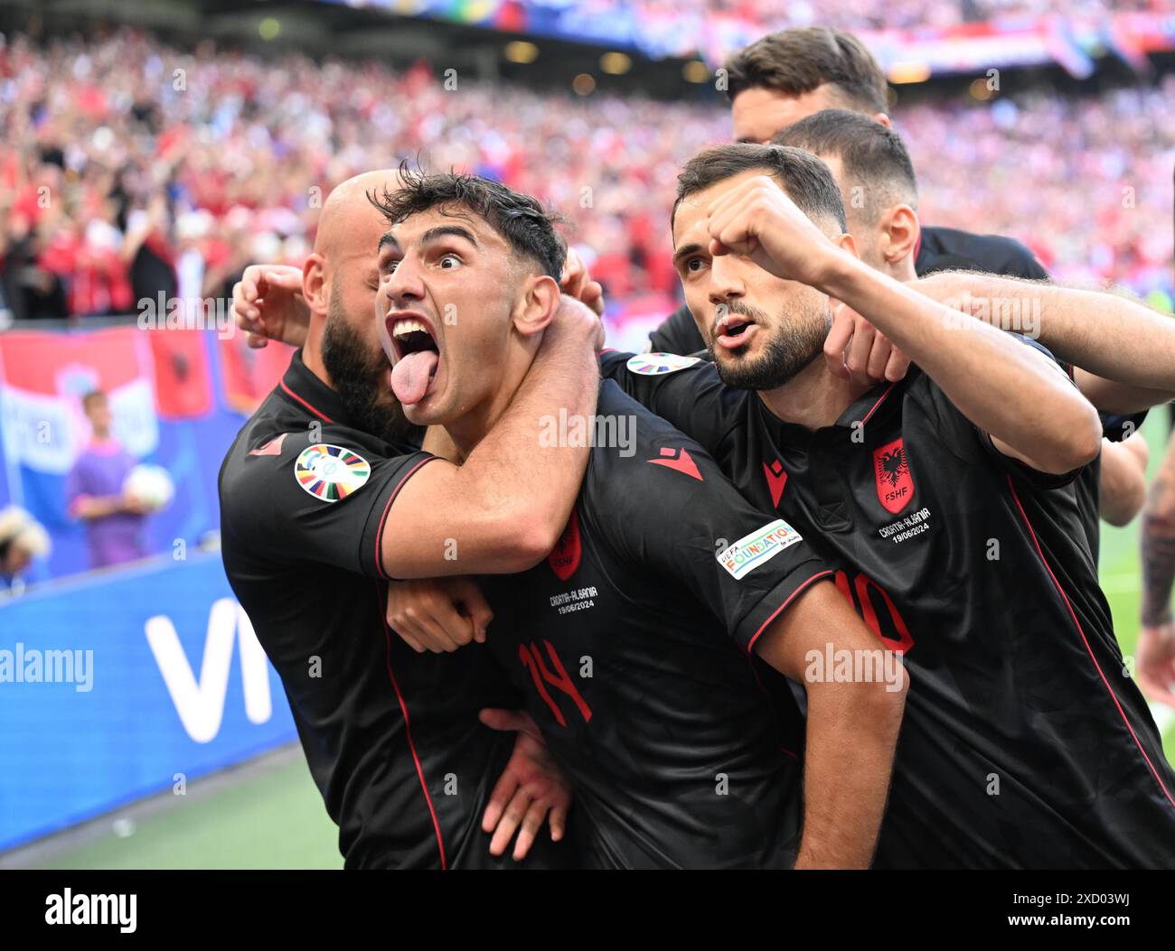 Hamburg. 19th June, 2024. Qazim Laci (2nd L) of Albania celebrates ...
