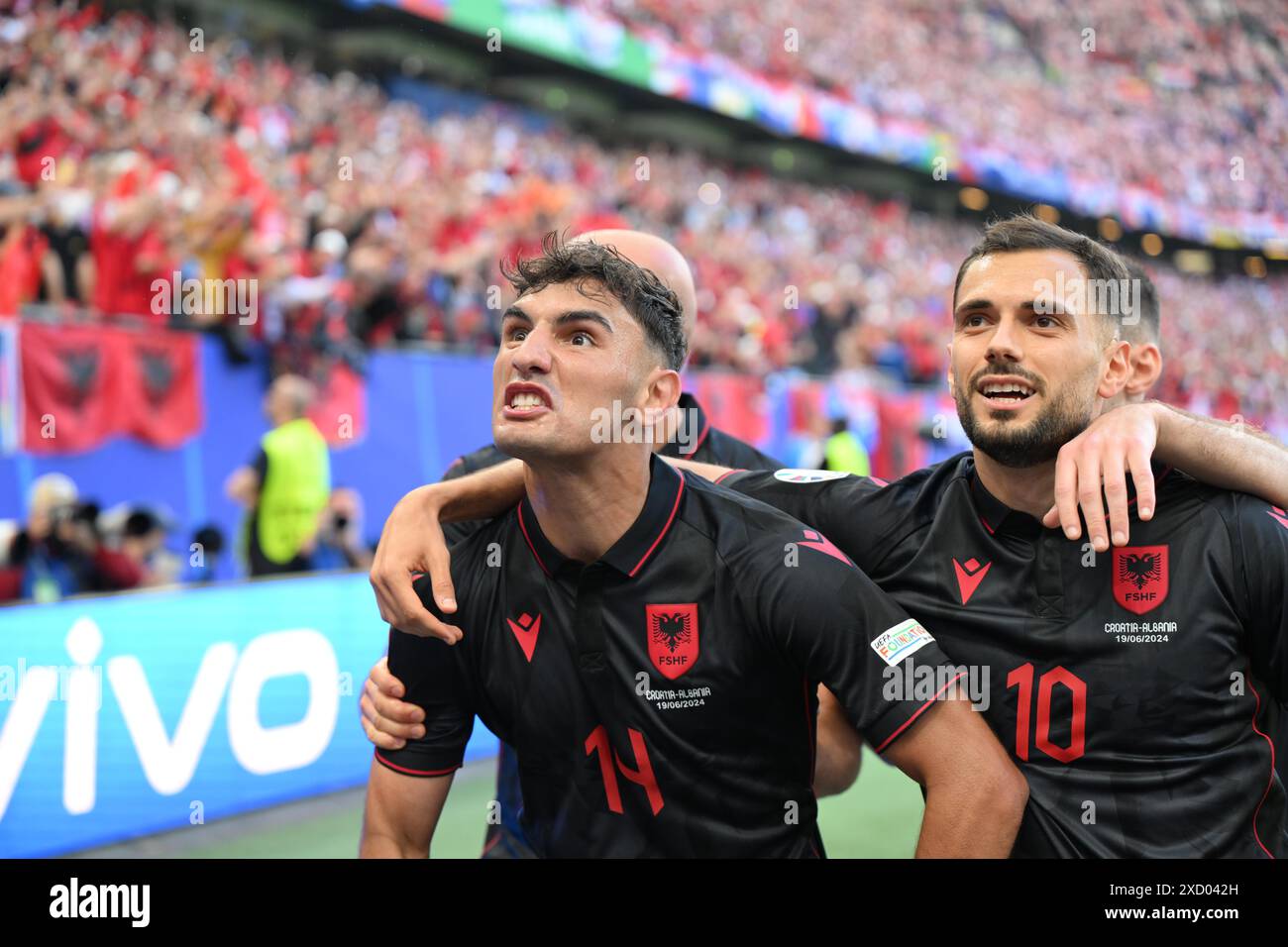 Hamburg. 19th June, 2024. Qazim Laci (L) of Albania celebrates after ...
