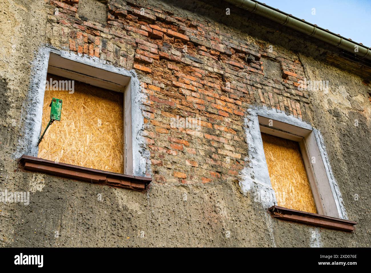 Boarded Up Windows On An Old Brick Building In Daylight Stock Photo - Alamy