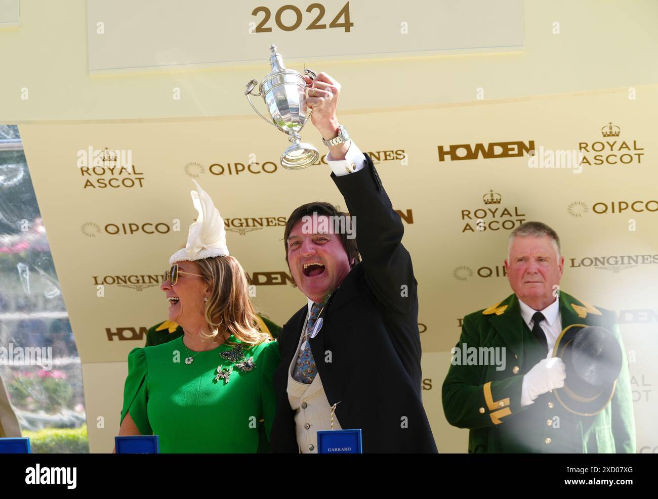 Horse owner David Howden celebrates with the trophy after Running Lion ...