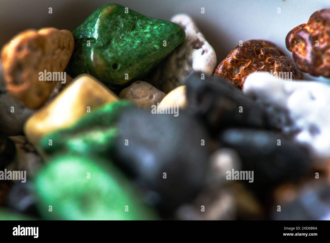 A detailed macro photo of colorful pebble chocolate, capturing the ...