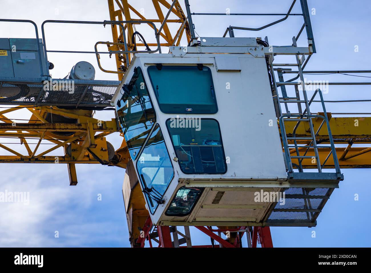Crane Cab With Yellow Boom and Blue Sky Stock Photo - Alamy