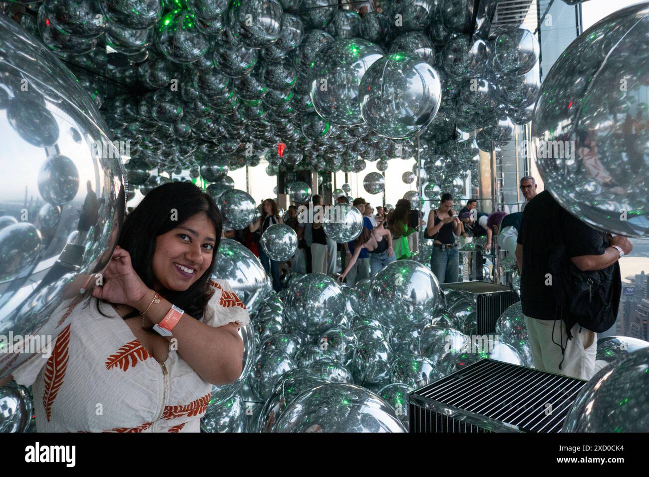 A woman is posing for a photograph at "Affinity" at Summit One ...
