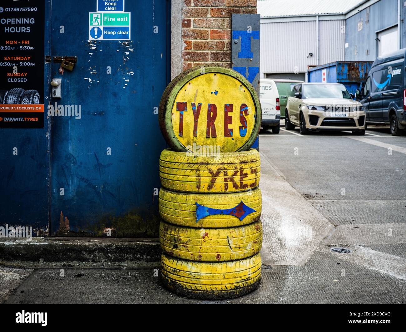 STACK OF YELLOW WITH BLUE ARROW TYRES TIRE RUBBER FOR AUTOMOTIVE ...