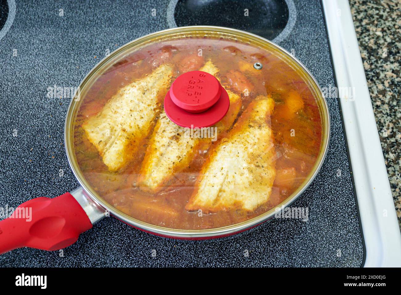 Miami Beach Florida,stove stovetop cooking fish,tilapia creole sauce ...
