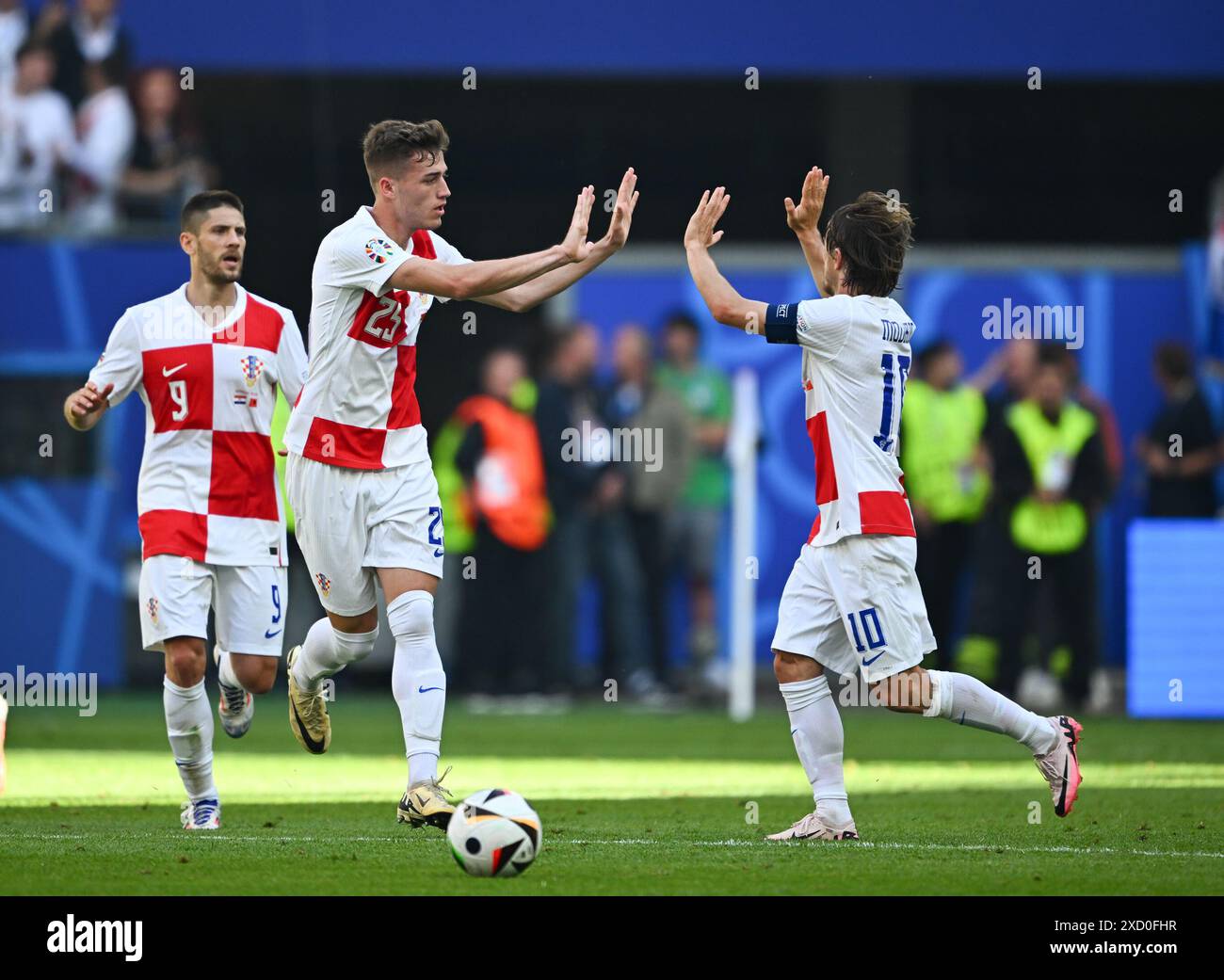 Hamburg, Germany. 19th June, 2024. Marko Pjaca of Croatia and Luka ...