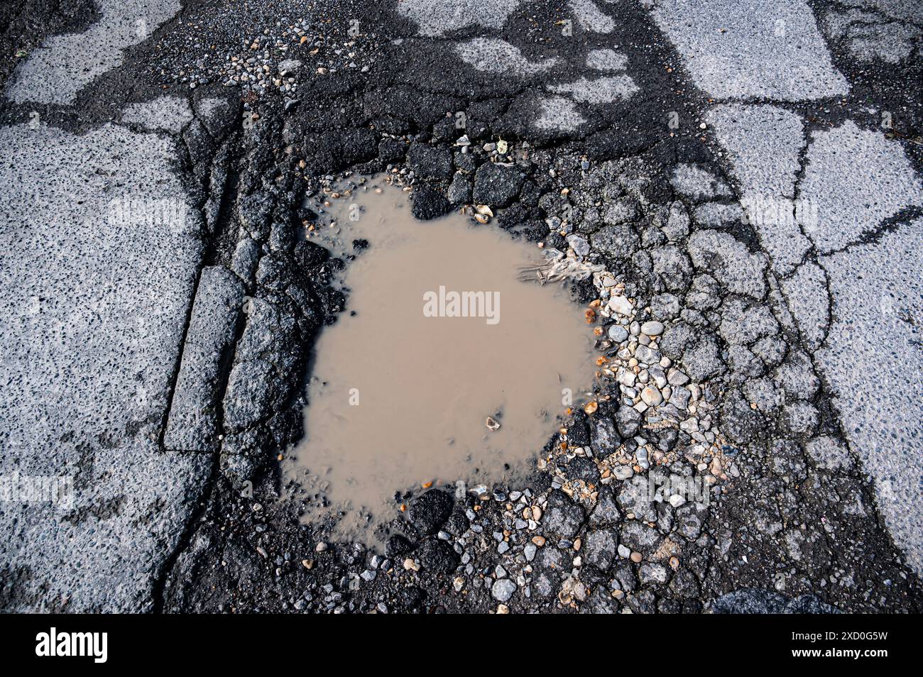 Cracks on asphalt filled hi-res stock photography and images - Alamy