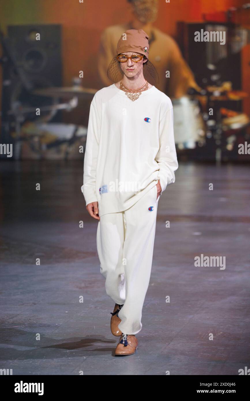 A model wears a creation for the Undercover Spring Summer 2025 ...