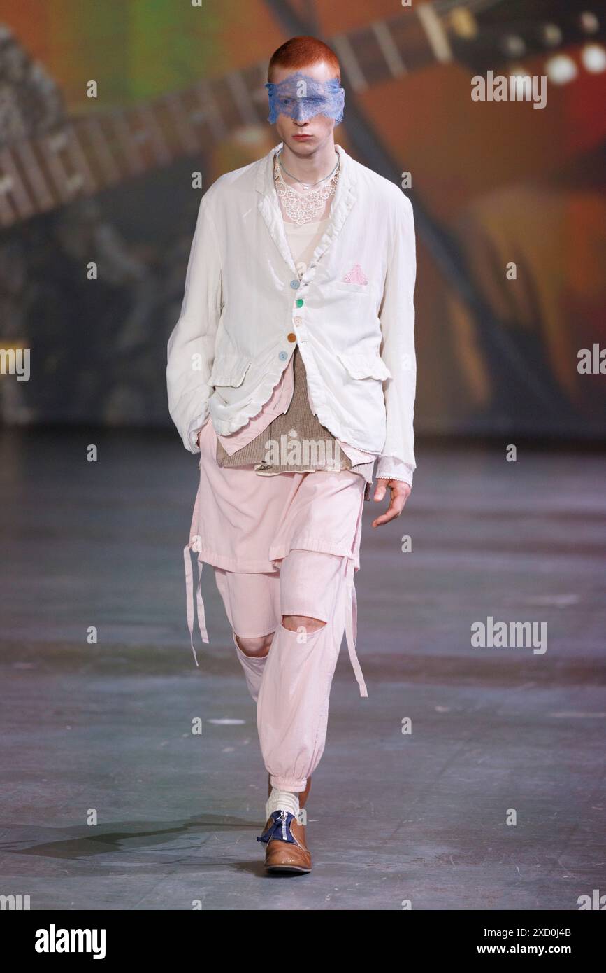 A model wears a creation for the Undercover Spring Summer 2025 ...