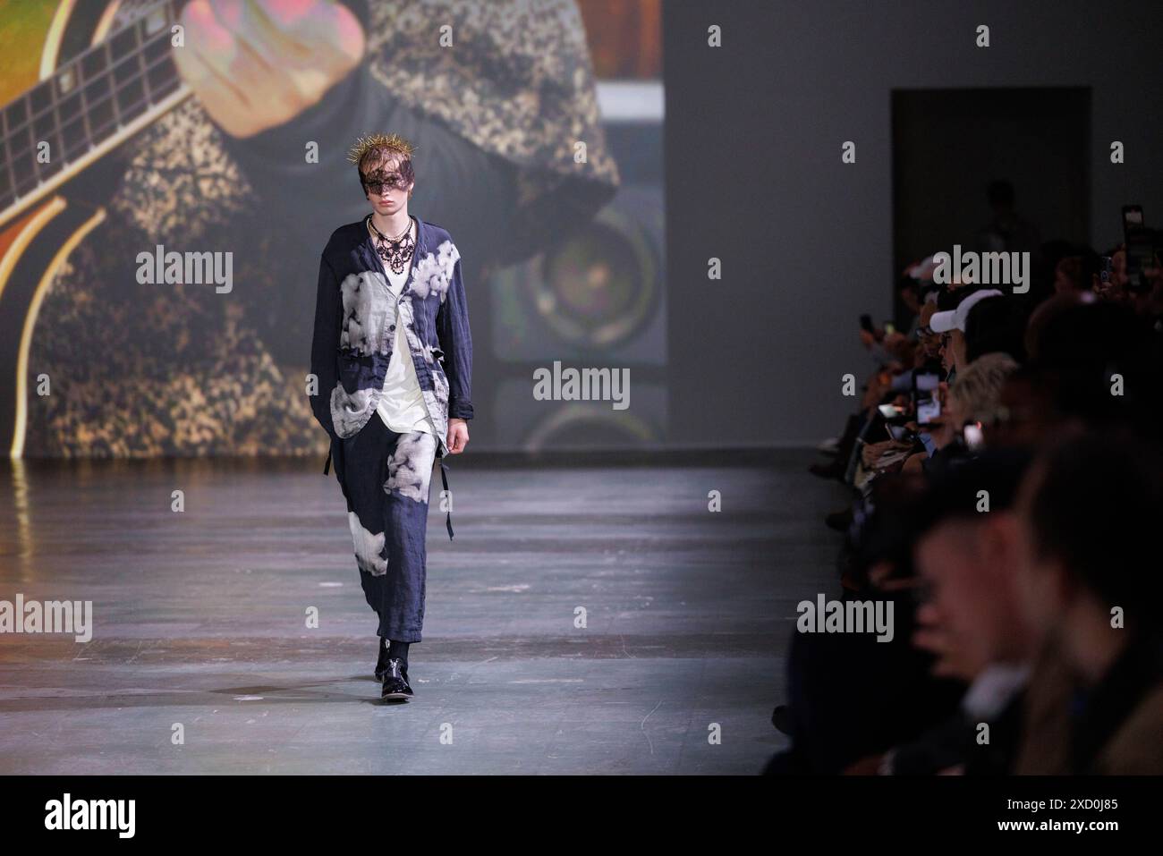 A model wears a creation for the Undercover Spring Summer 2025 ...